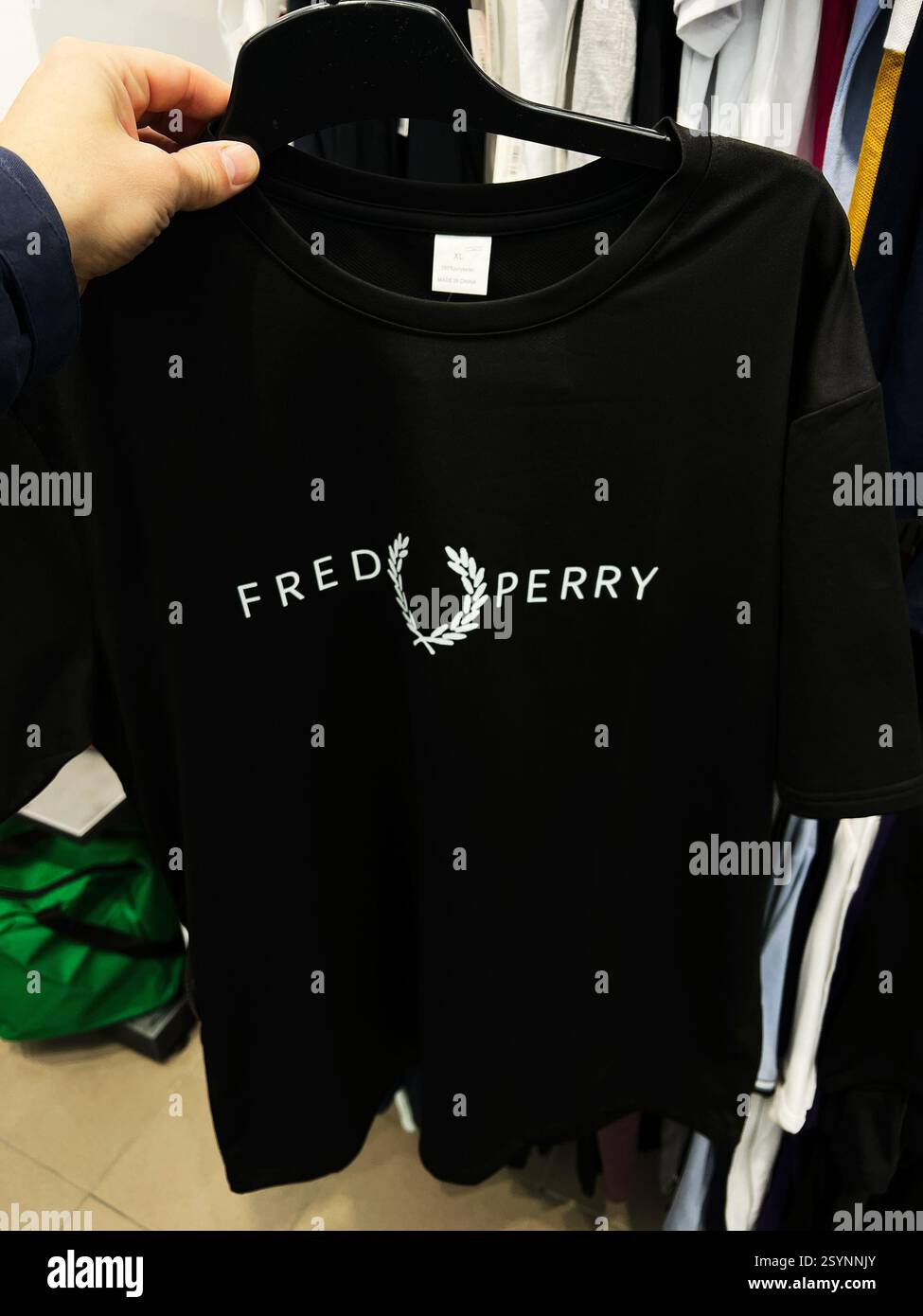 Kyiv, Ukraine - February 27, 2025: A black branded Fred Perry T-shirt ...
