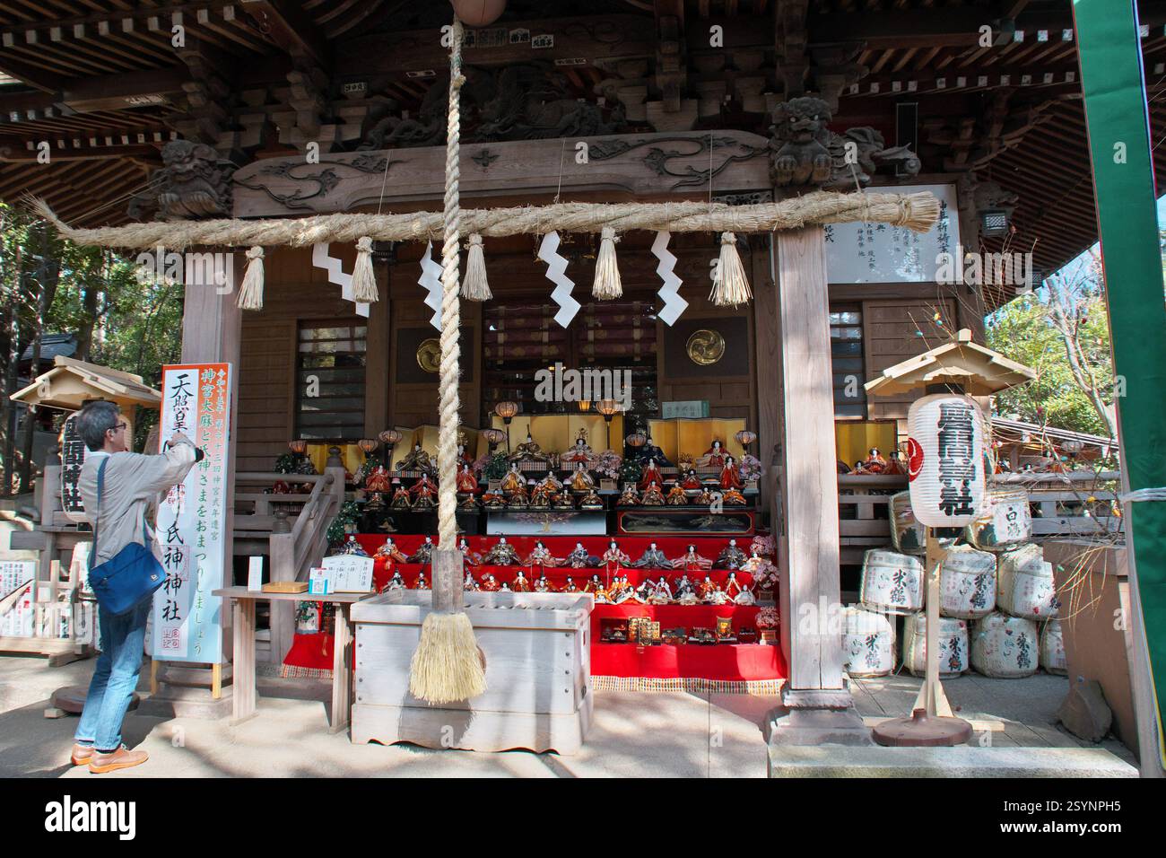 Zama, Japan. 01st Mar, 2025. Visitor takes photos during the Doll Festival at the Zama shrine in ...