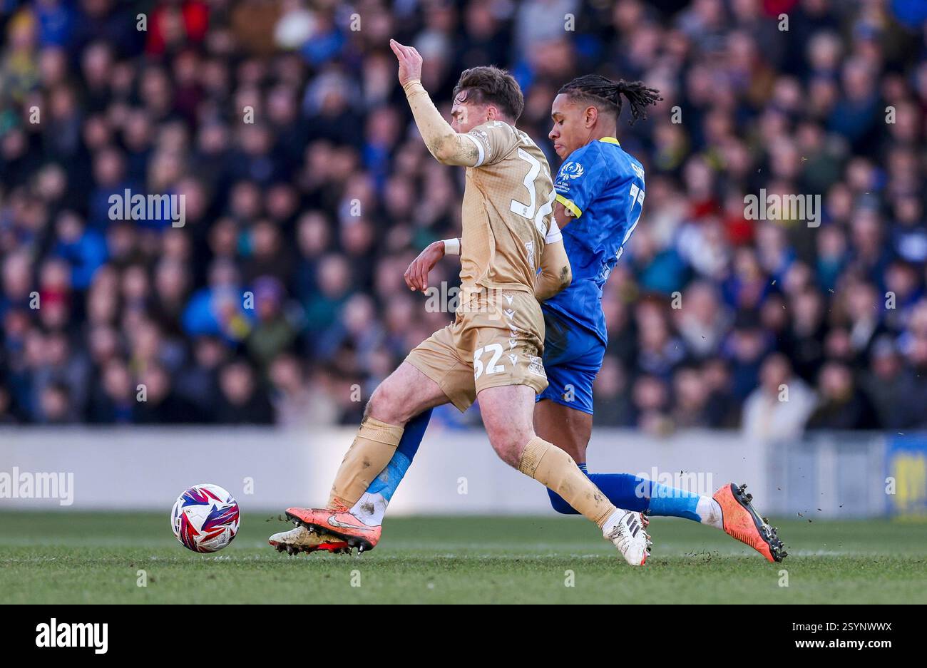 Bromley's Ben Thompson is tackled by AFC Wimbledon Alistair Smith during the Sky Bet League Two ...