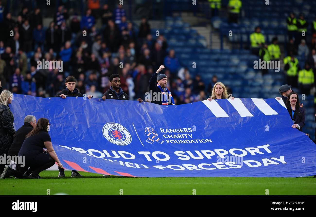 A banner is displayed on the pitch at half time as part of Rangers ...