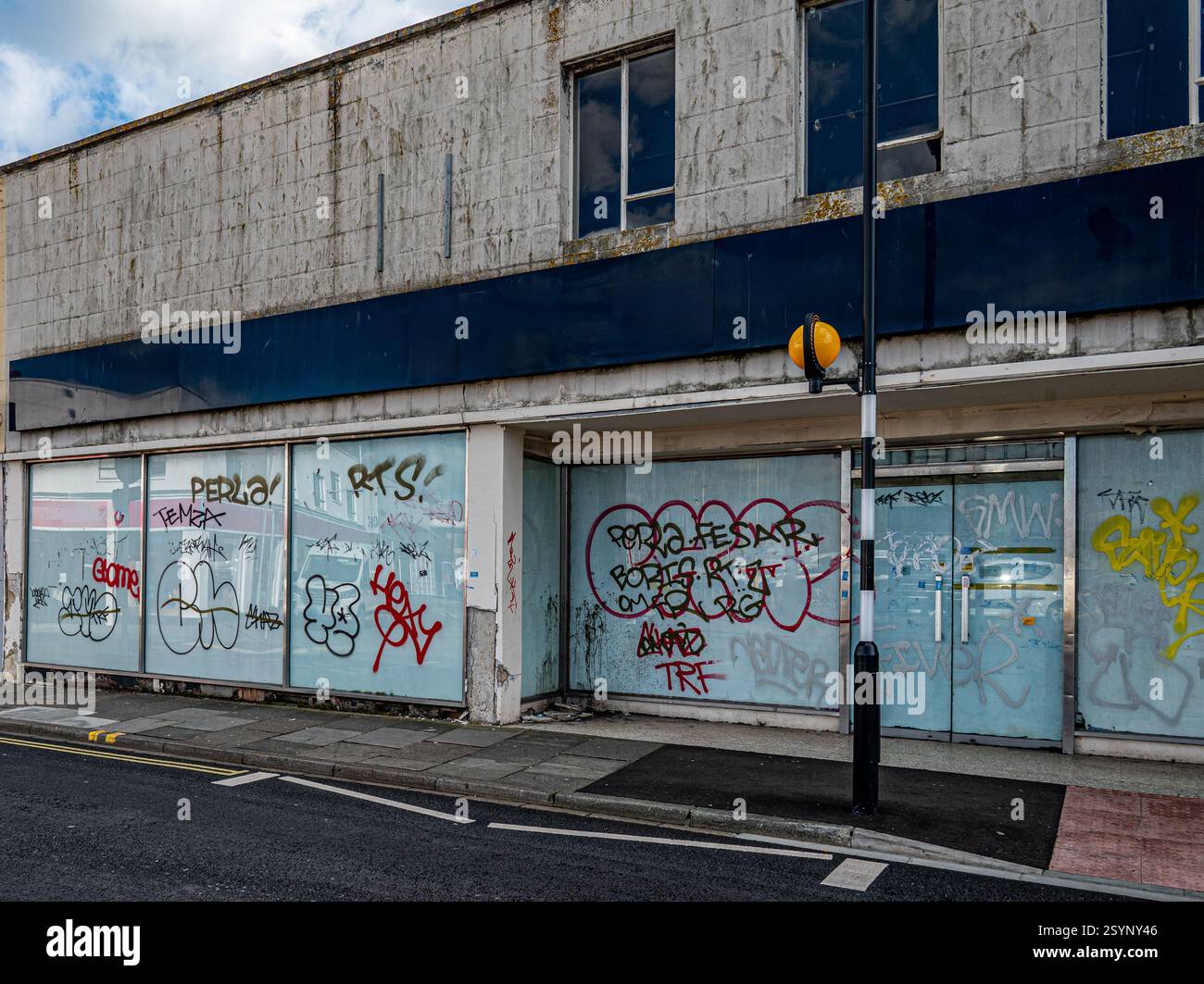 Closed and empty shops in a UK shopping centre portraying the downturn ...