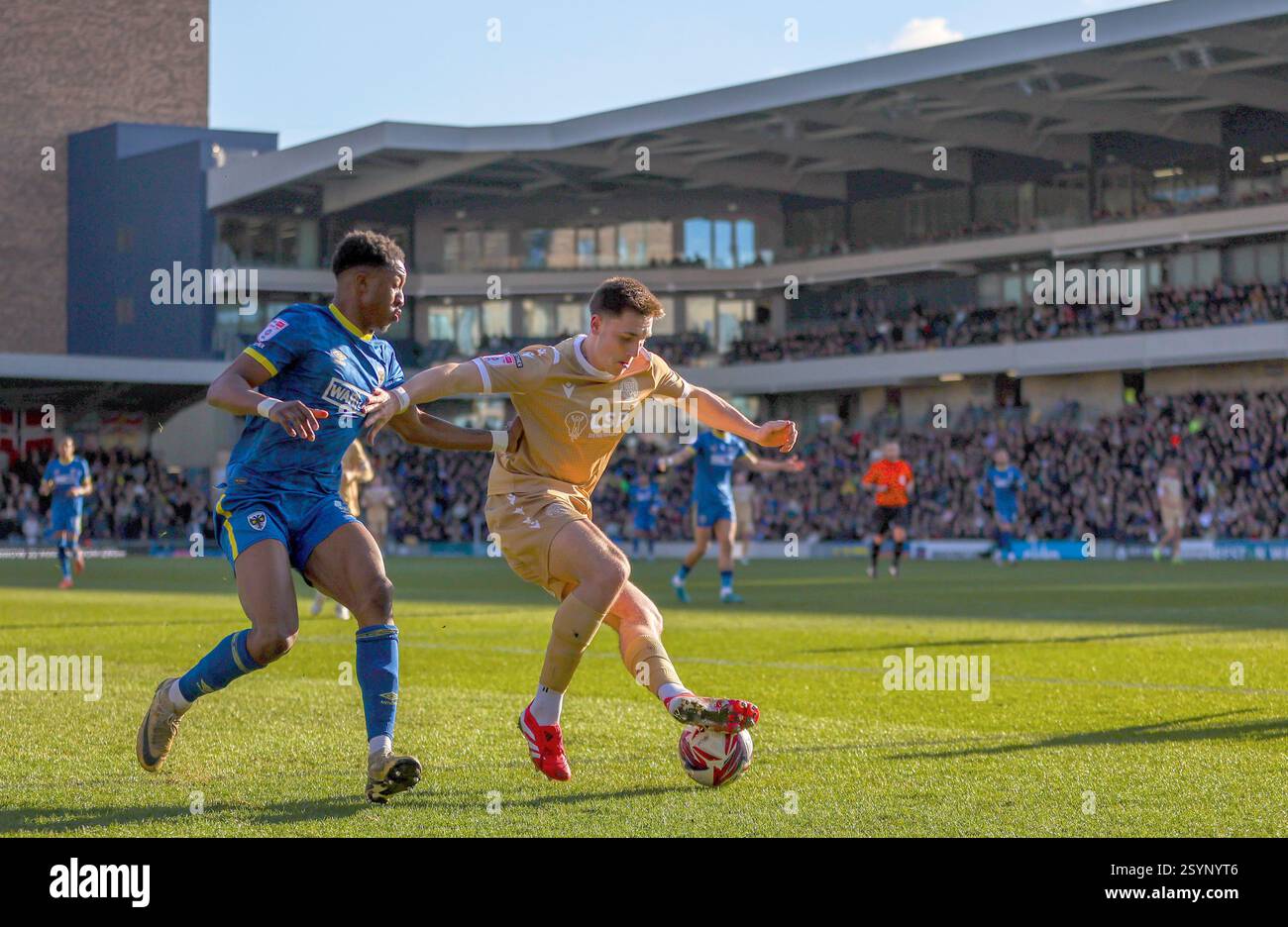 Bromley's Adam Mayor and AFC Wimbledon's Josh Neufville in action ...