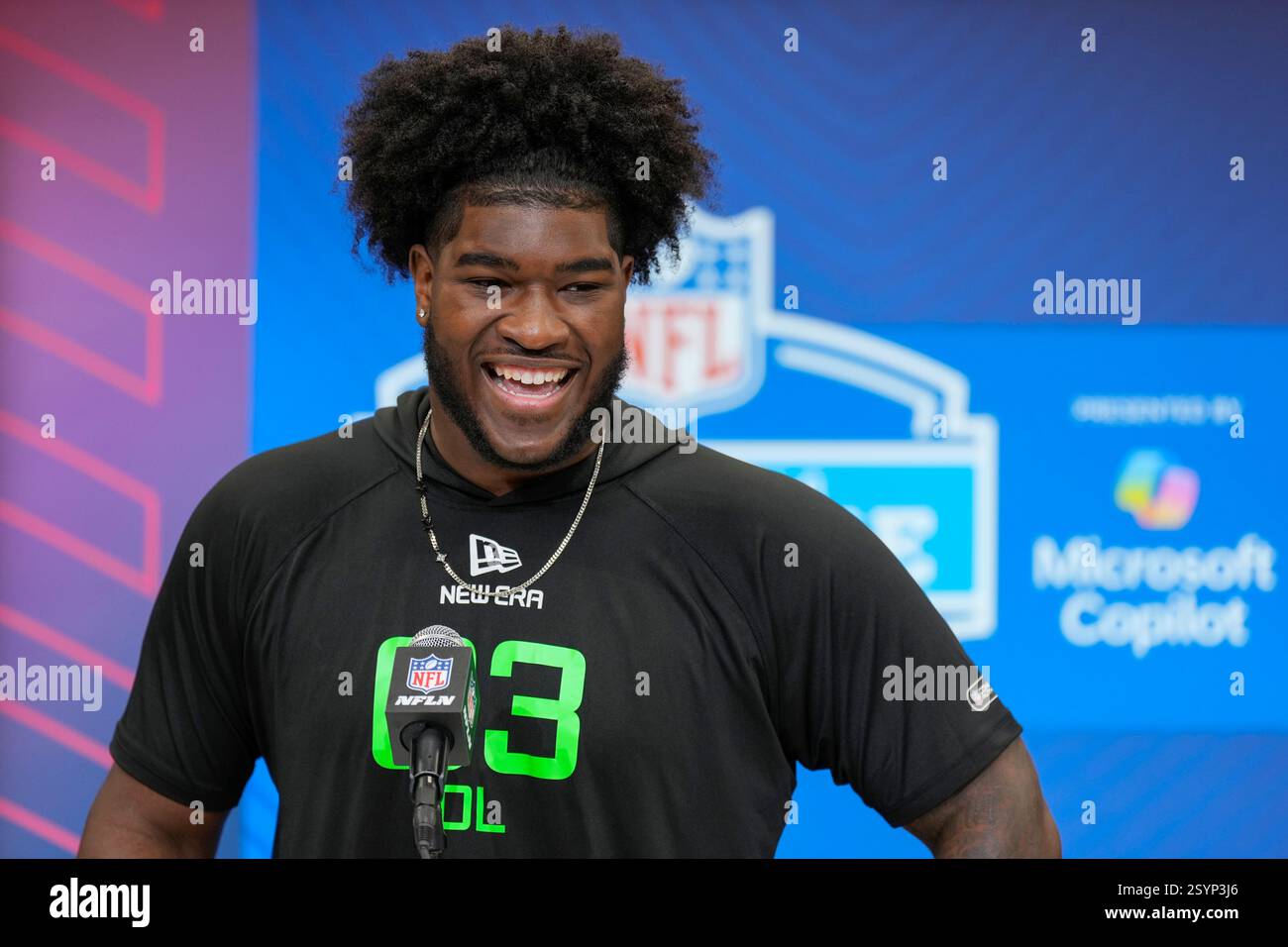 Alabama offensive lineman Tyler Booker speaks during a press conference ...
