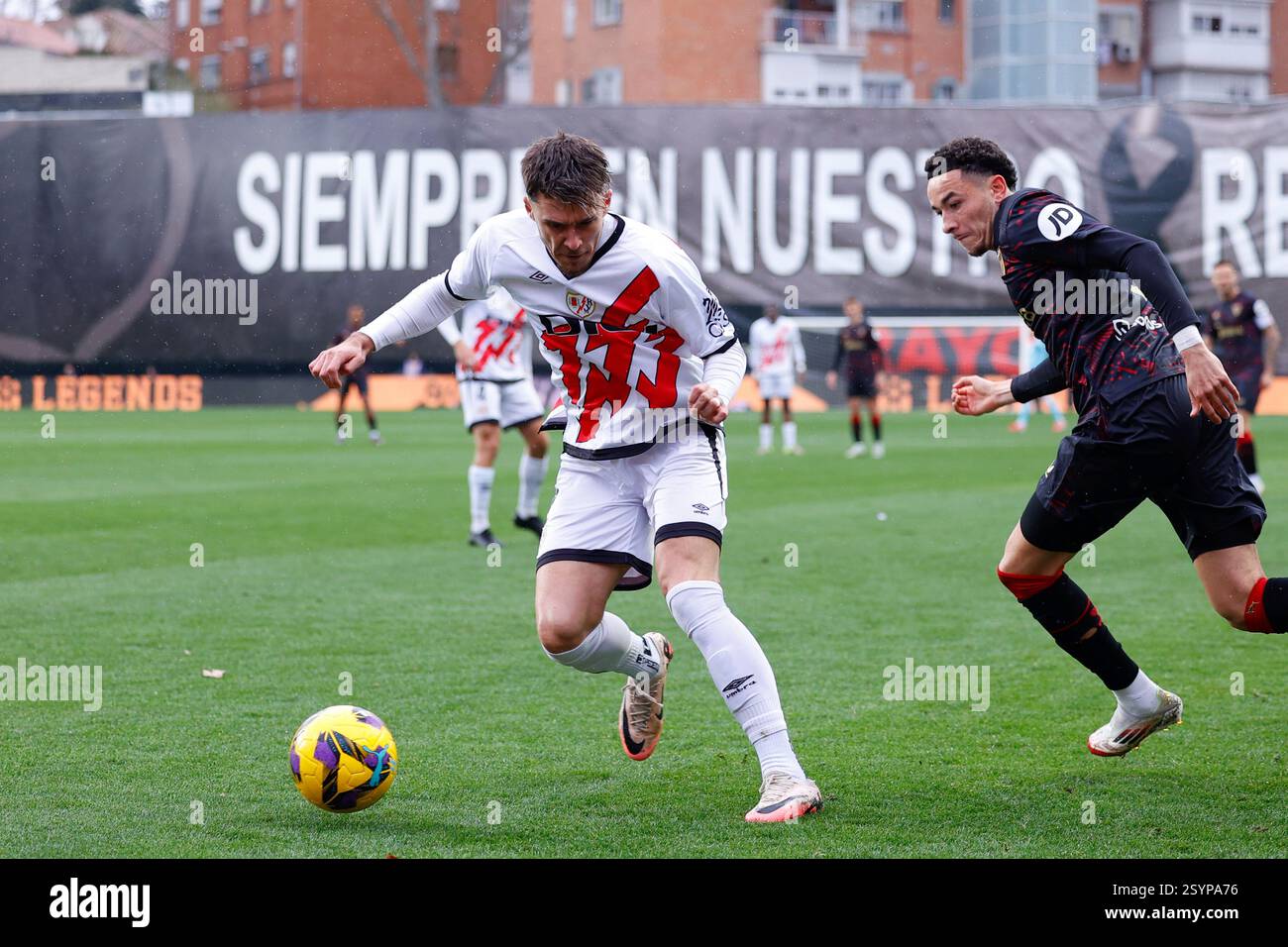Andrei Ratiu of Rayo Vallecano and Ruben Vargas of Sevilla FC in action in action during the ...