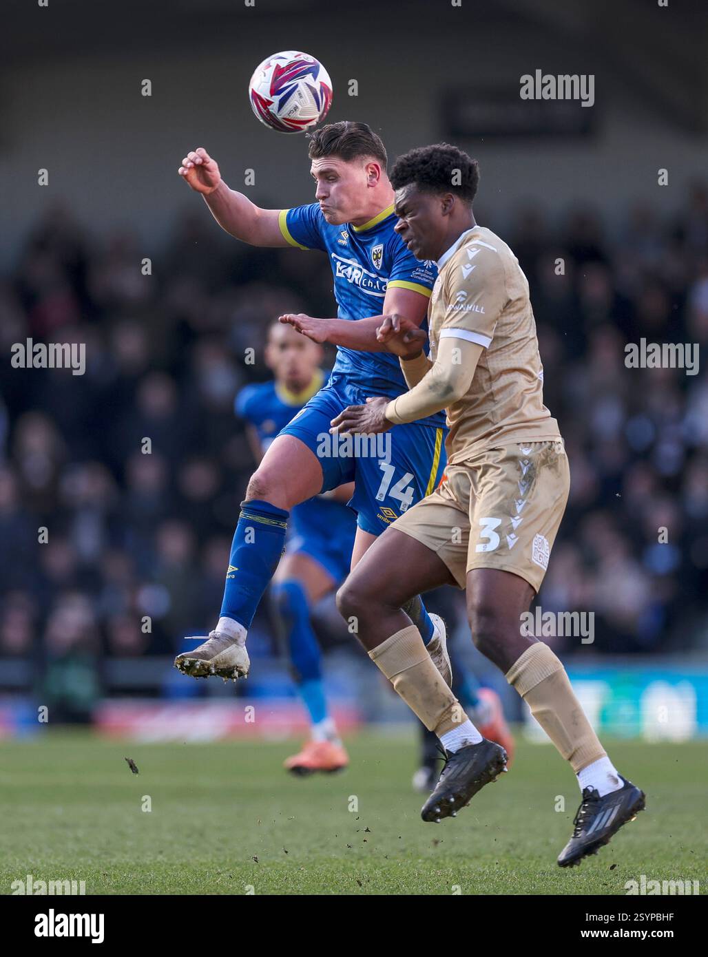 AFC Wimbledon's Matty Stevens and Bromley's Deji Elerewe in action ...