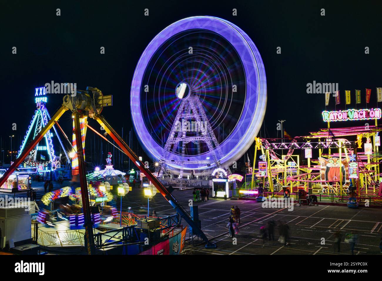 Colorful motion blur of amusement park rides at 2025 Carnaval de Santa ...