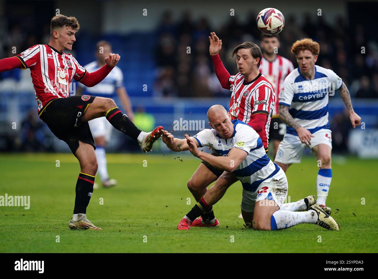 Sheffield United's Harrison Burrows clears the ball under pressure from ...