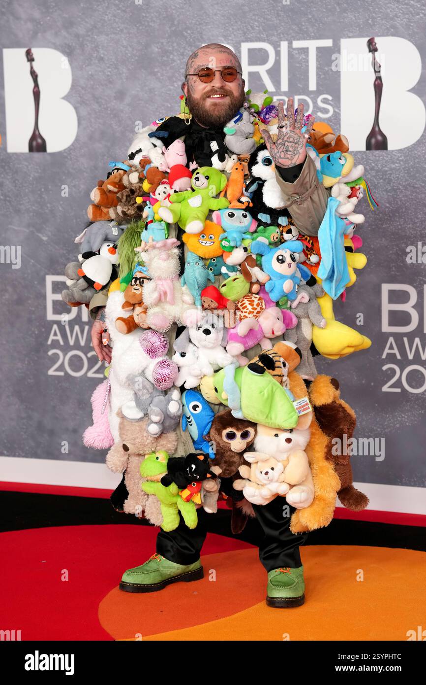 Teddy Swims poses for photographers upon arrival at the Brit Awards ...