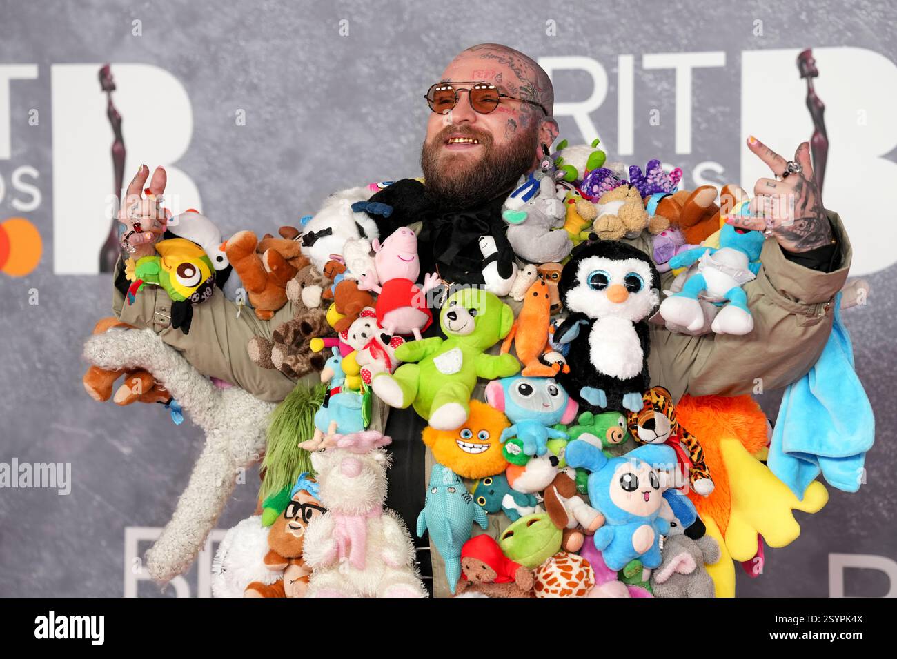 Teddy Swims poses for photographers upon arrival at the Brit Awards ...
