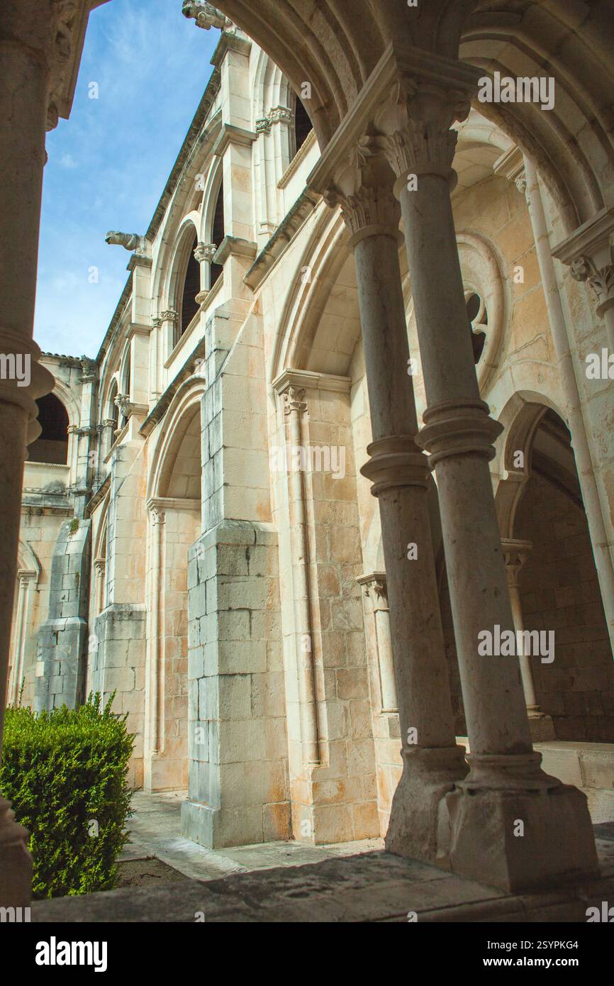 a picturesque view through a series of arched windows within a historic ...