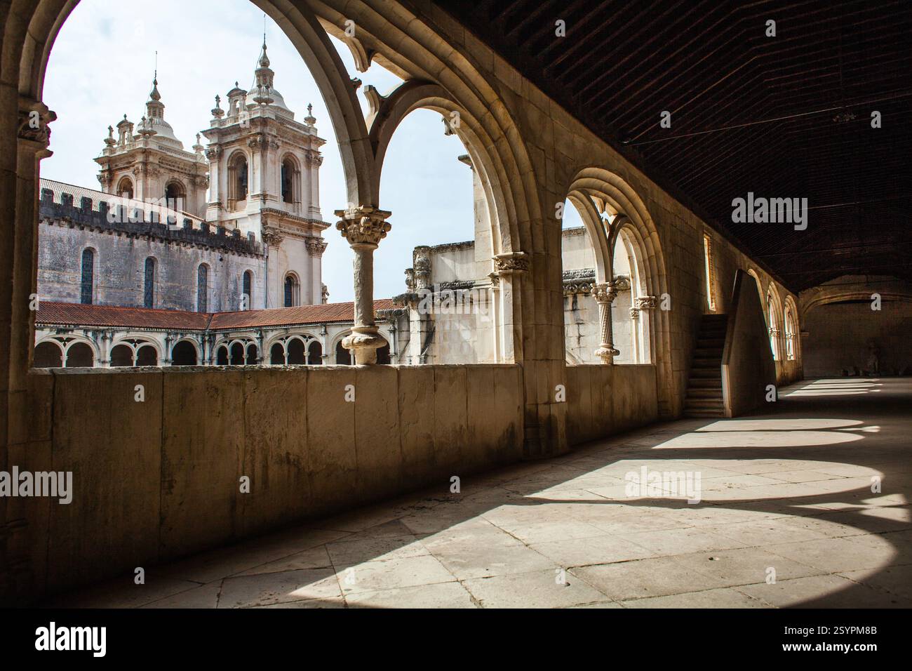 a picturesque view through a series of arched windows within a historic ...