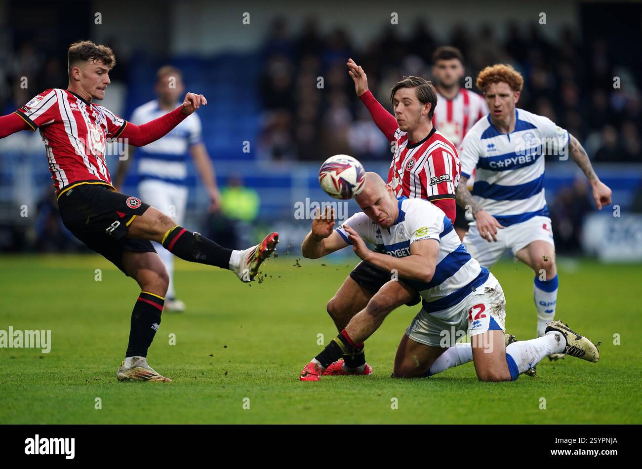 Sheffield United's Harrison Burrows clears the ball under pressure from ...
