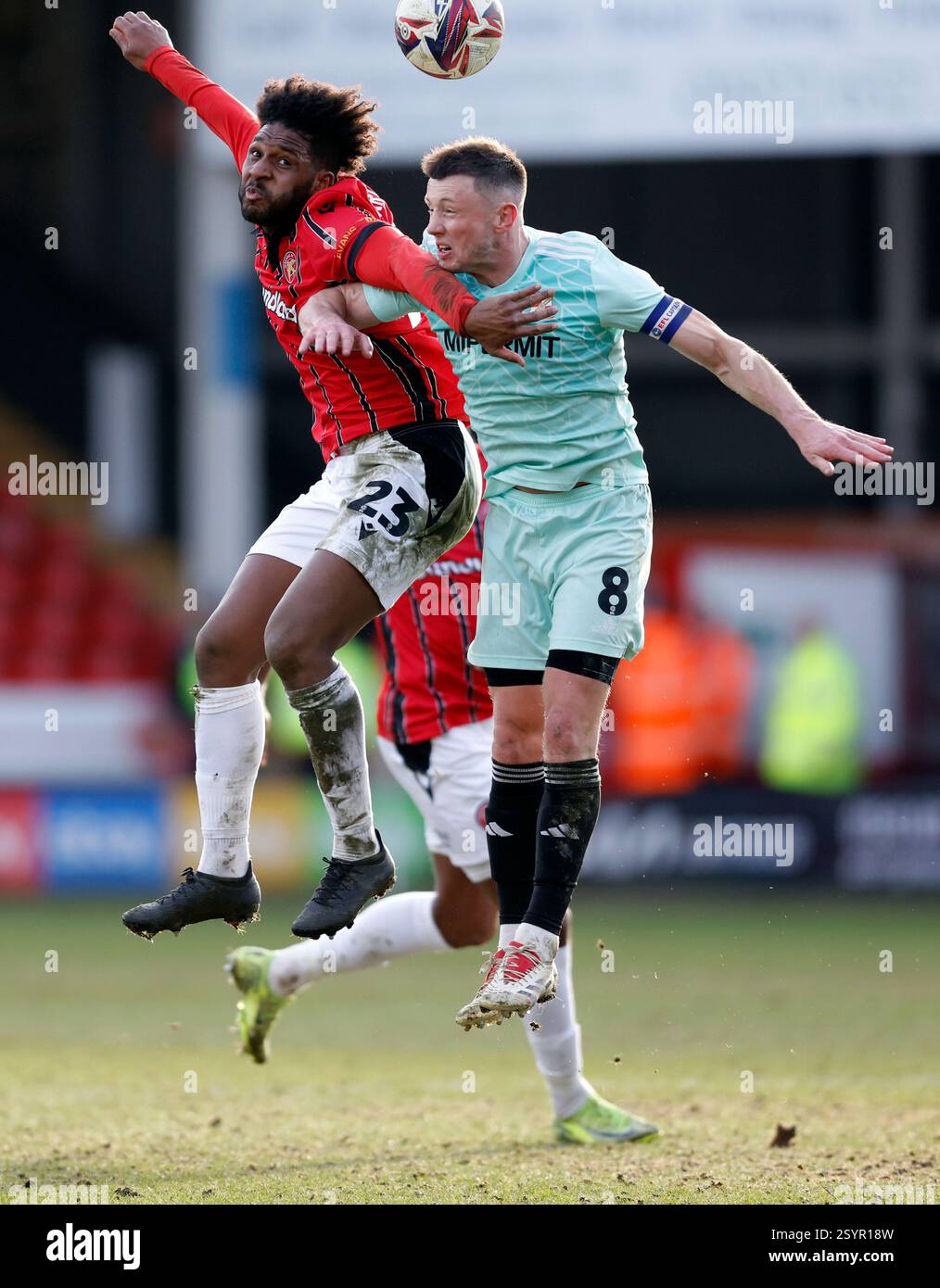 Walsall's Ellis Harrison (left) and Swindon Town's Ollie Clarke (right ...