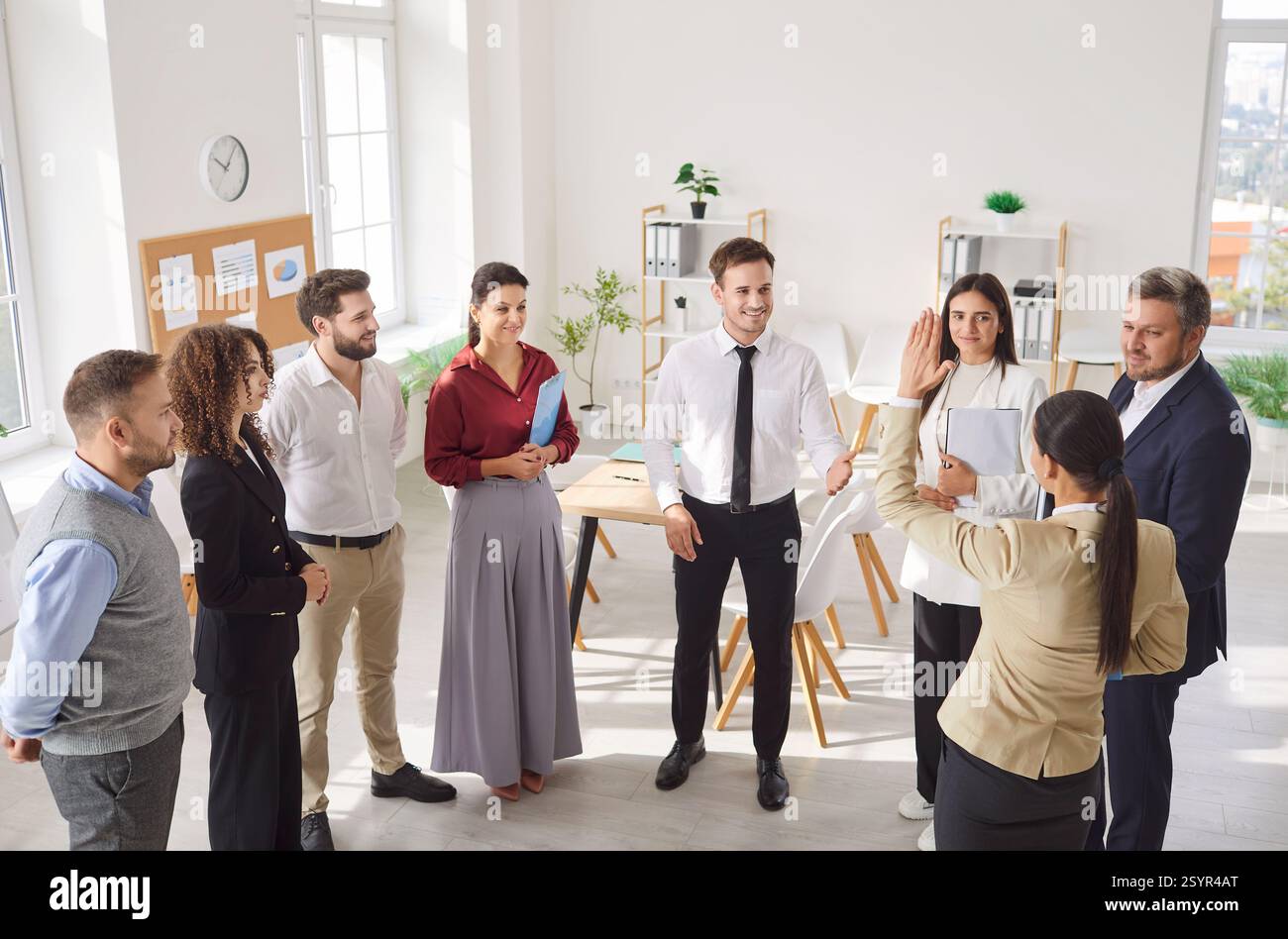 Business people standing talking, presenter coach gives corporate ...