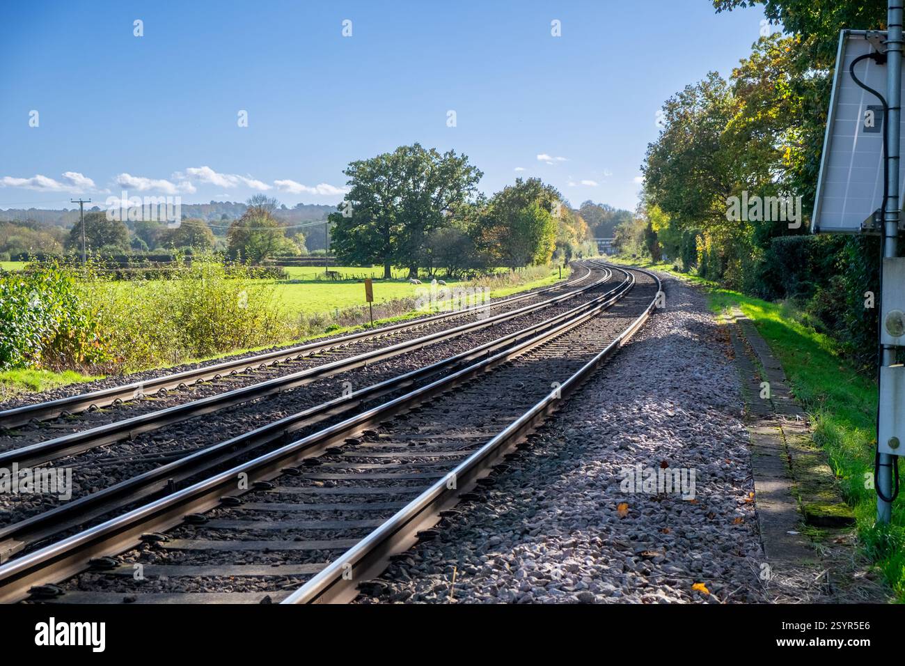 Railway tracks going through open countryside in Surrey, UK Stock Photo ...