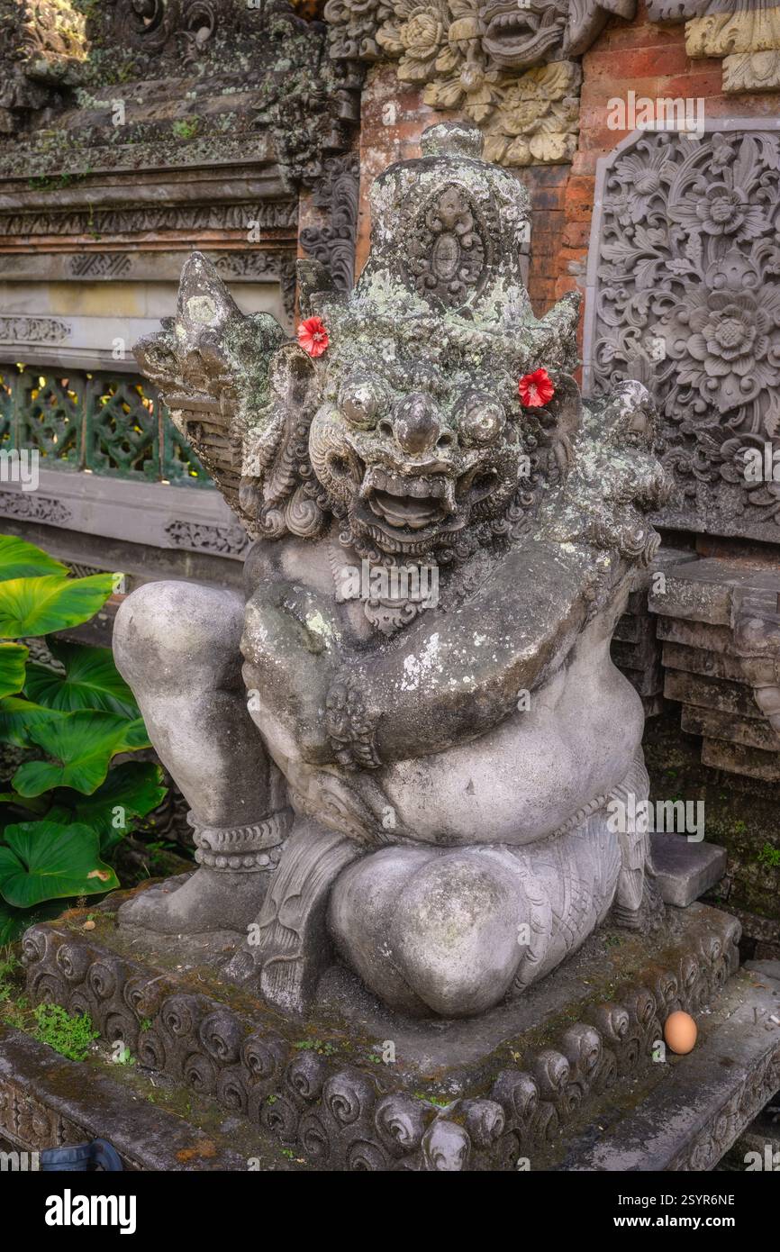 Bali, Indonesia, 10 Oct 2024 A stunning stone statue, adorned with ...