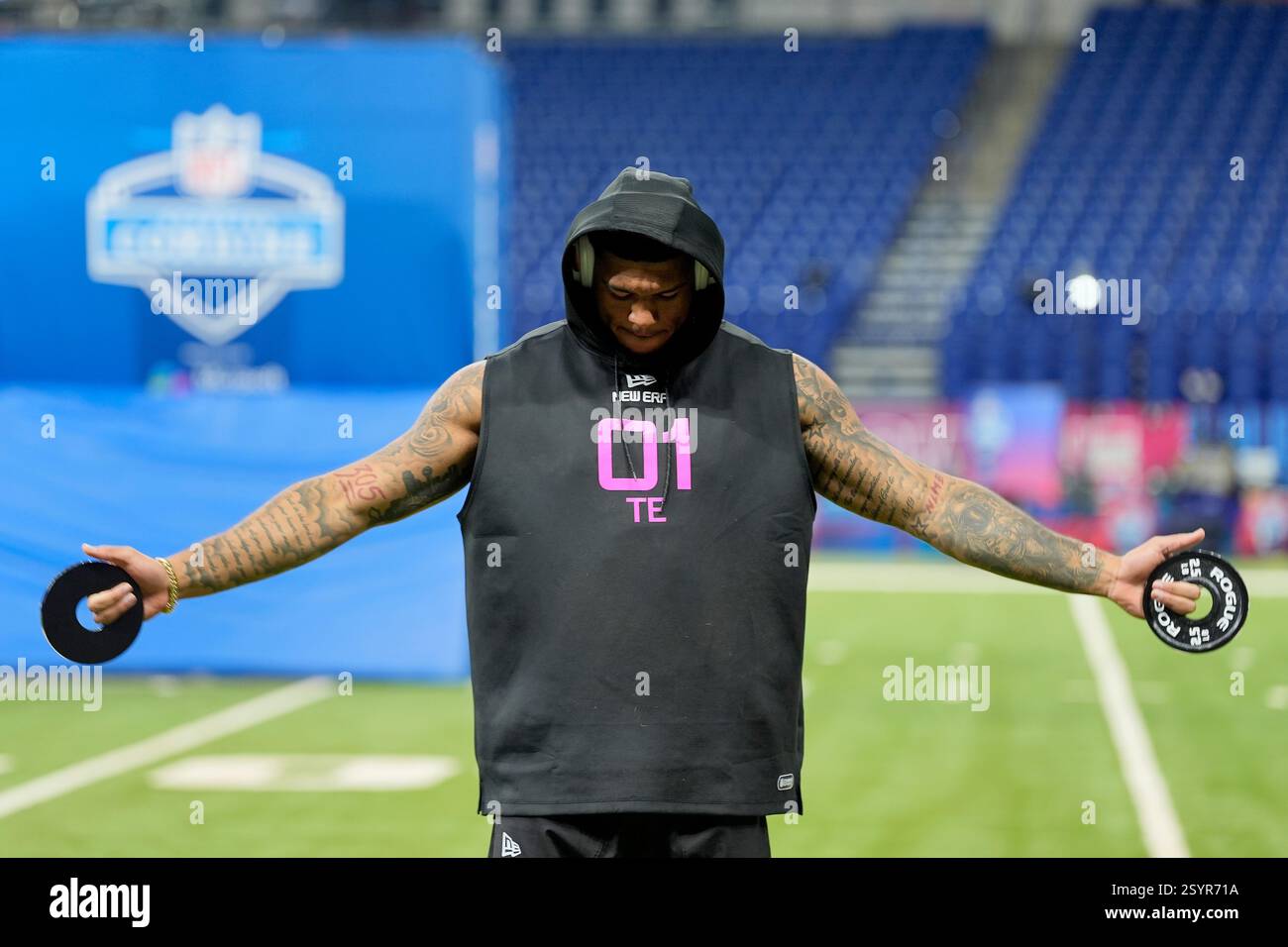 Miami tight end Elijah Arroyo stretches at the NFL football scouting ...