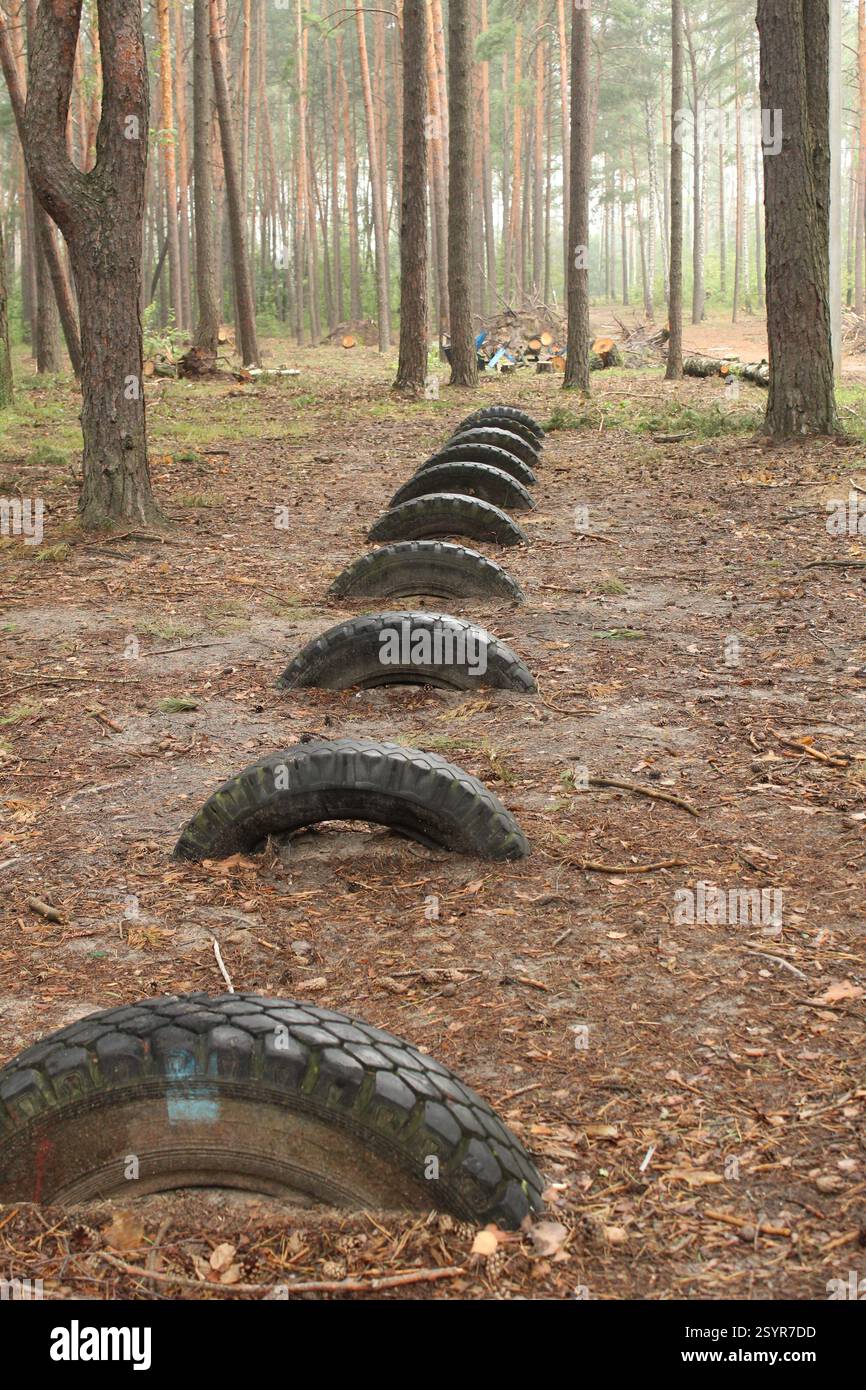 Car tires are lying on the ground. Resource reuse Stock Photo - Alamy