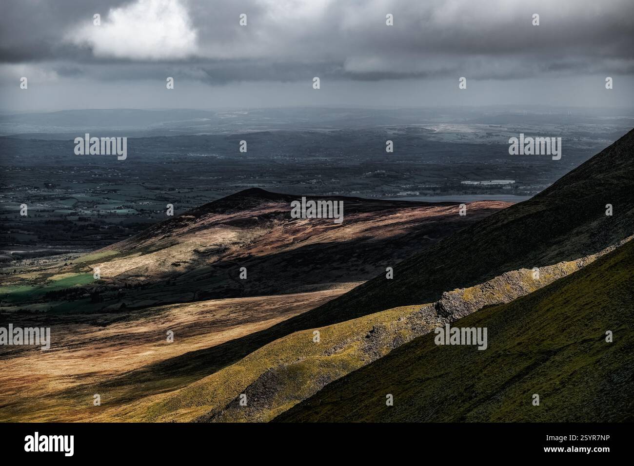 Explore the breathtaking vistas along the Carrauntoohil walkway with its rolling hills and ...