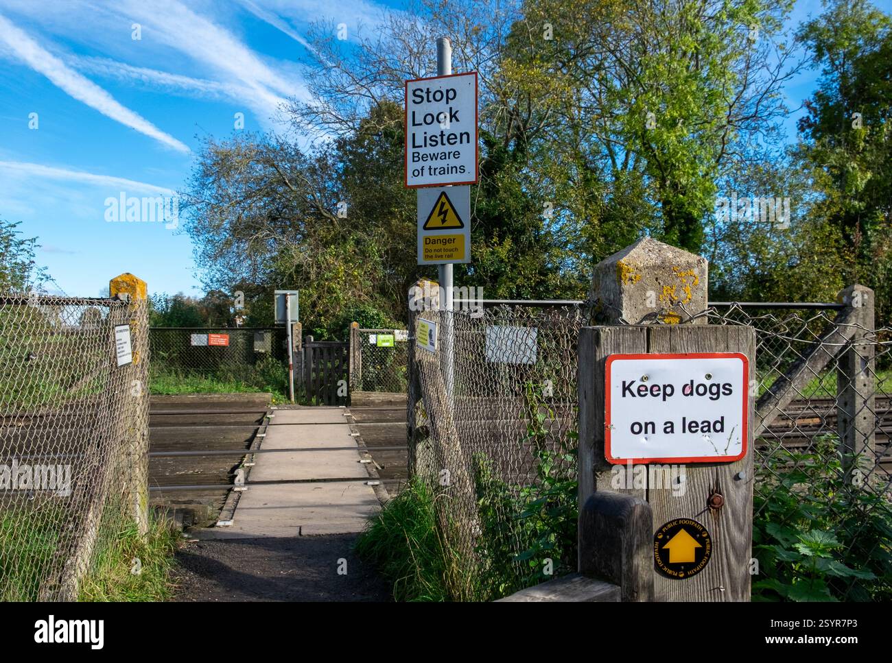 Stop, look, listen, beware of trains sign in England Stock Photo - Alamy