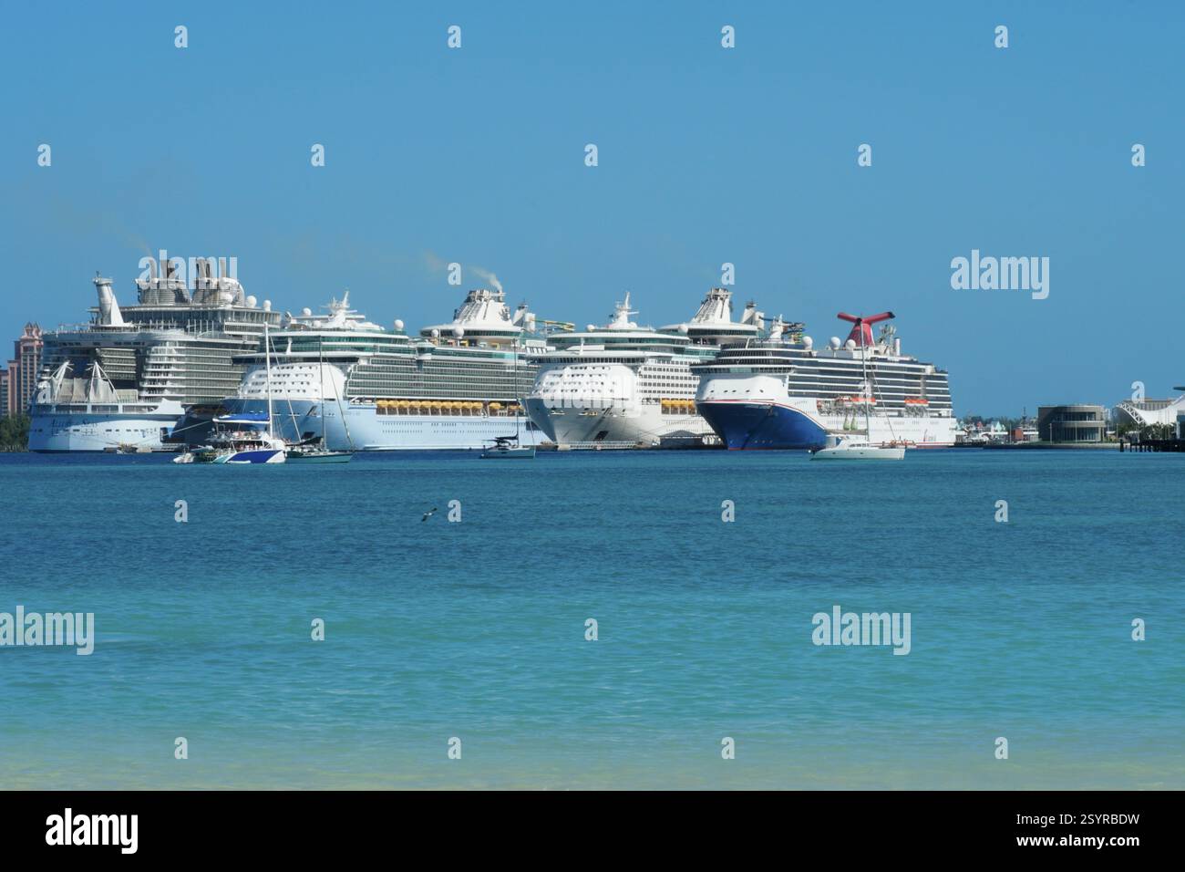 Four luxury cruise passenger ships observed from a cargo container ...