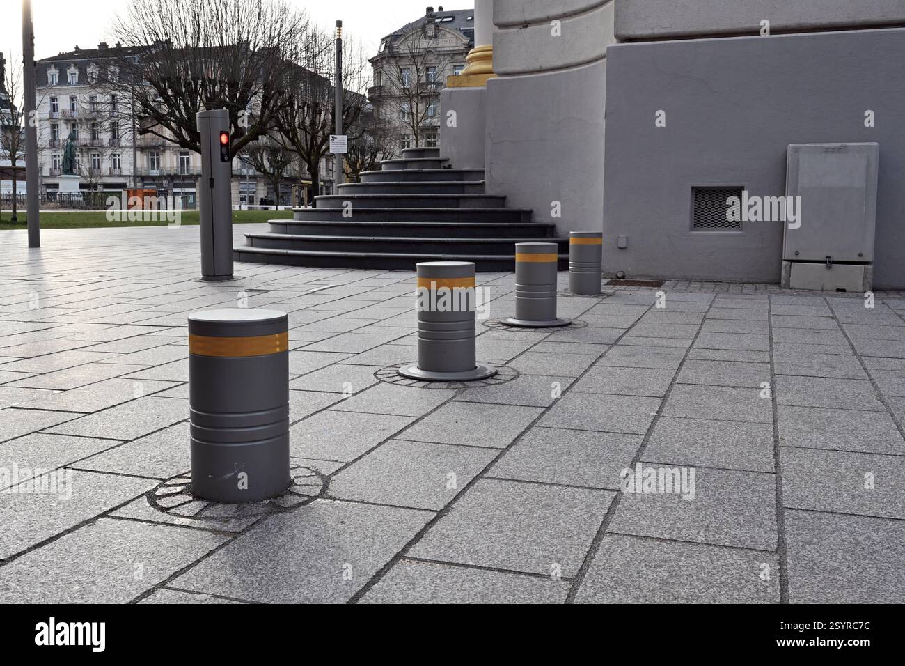 Automatic security bollards used as vehicle barrier Stock Photo - Alamy