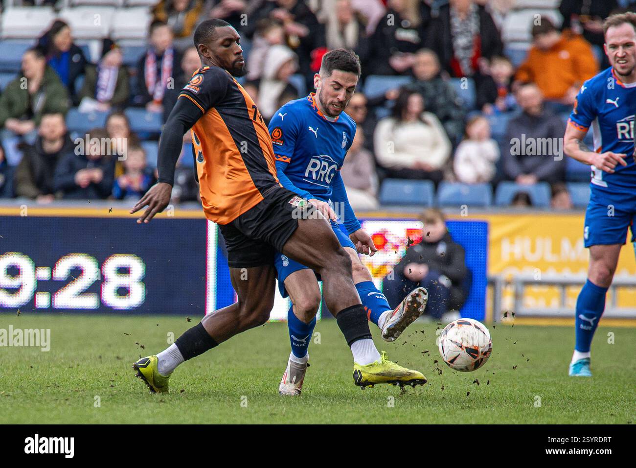Oldham on Saturday 1st March 2025. Oldham Athletic's Tom Pett battles ...