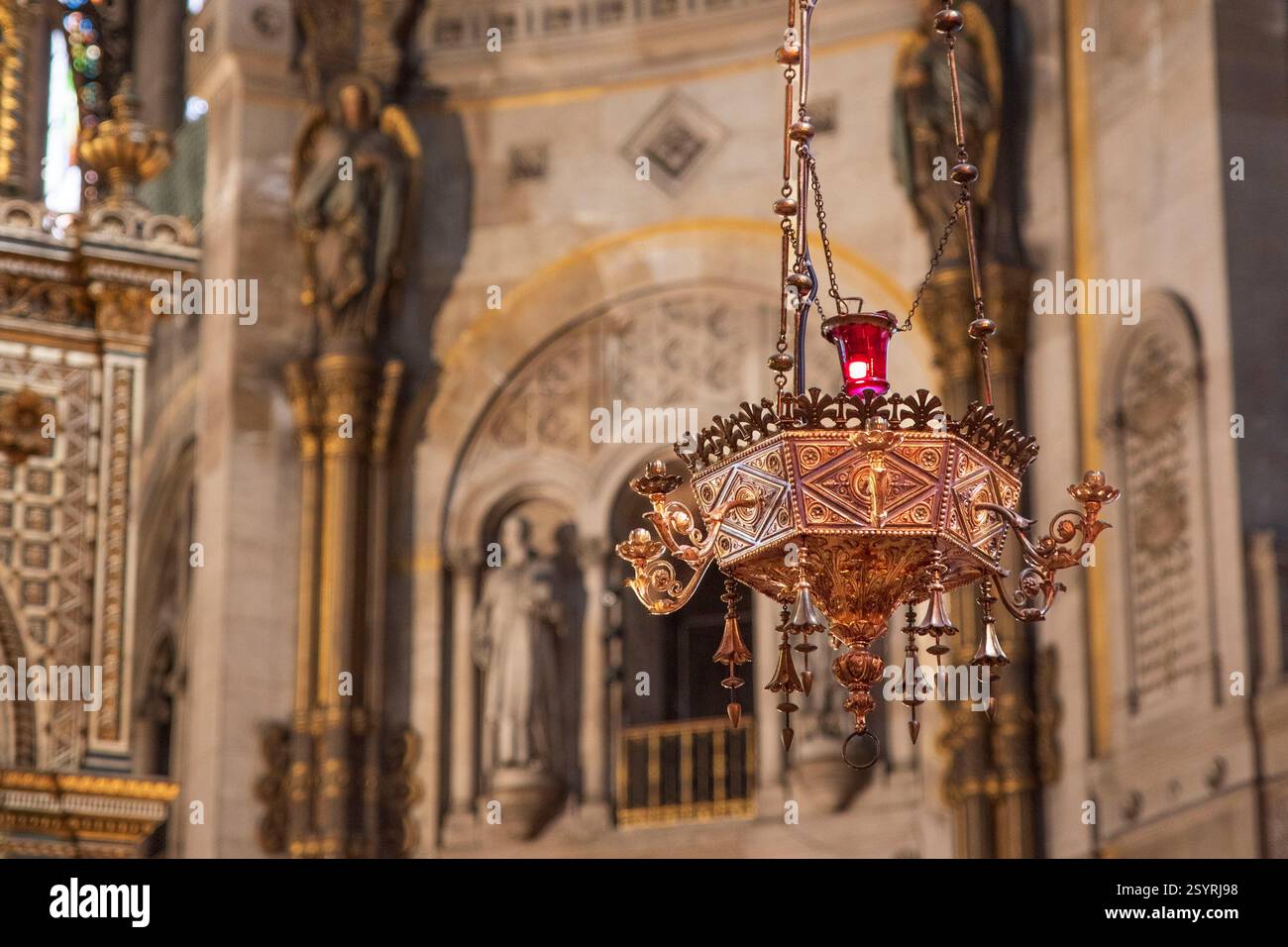Red lamp in a Catholic church to symbolize Jesus' presence next to the ...