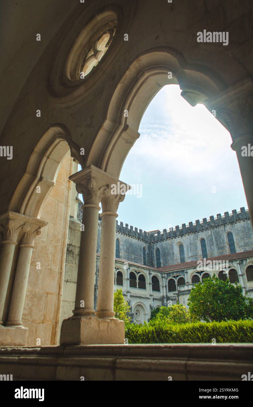 a picturesque view through a series of arched windows within a historic ...
