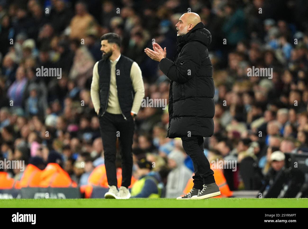 Manchester City manager Pep Guardiola (right) and Plymouth Argyle ...