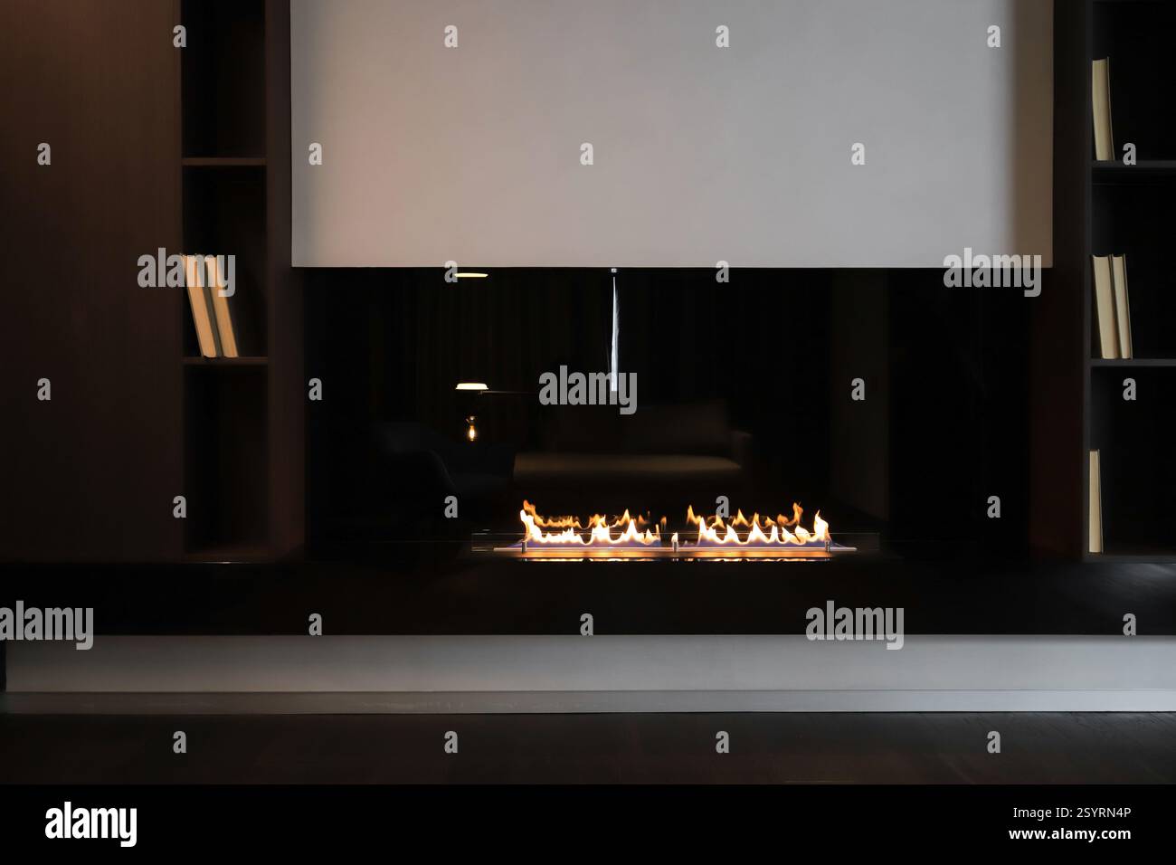 Burning eco bio fireplace close-up in the living room interior Stock ...