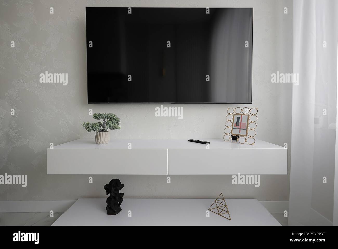 Modern large TV in the living room interior Stock Photo - Alamy