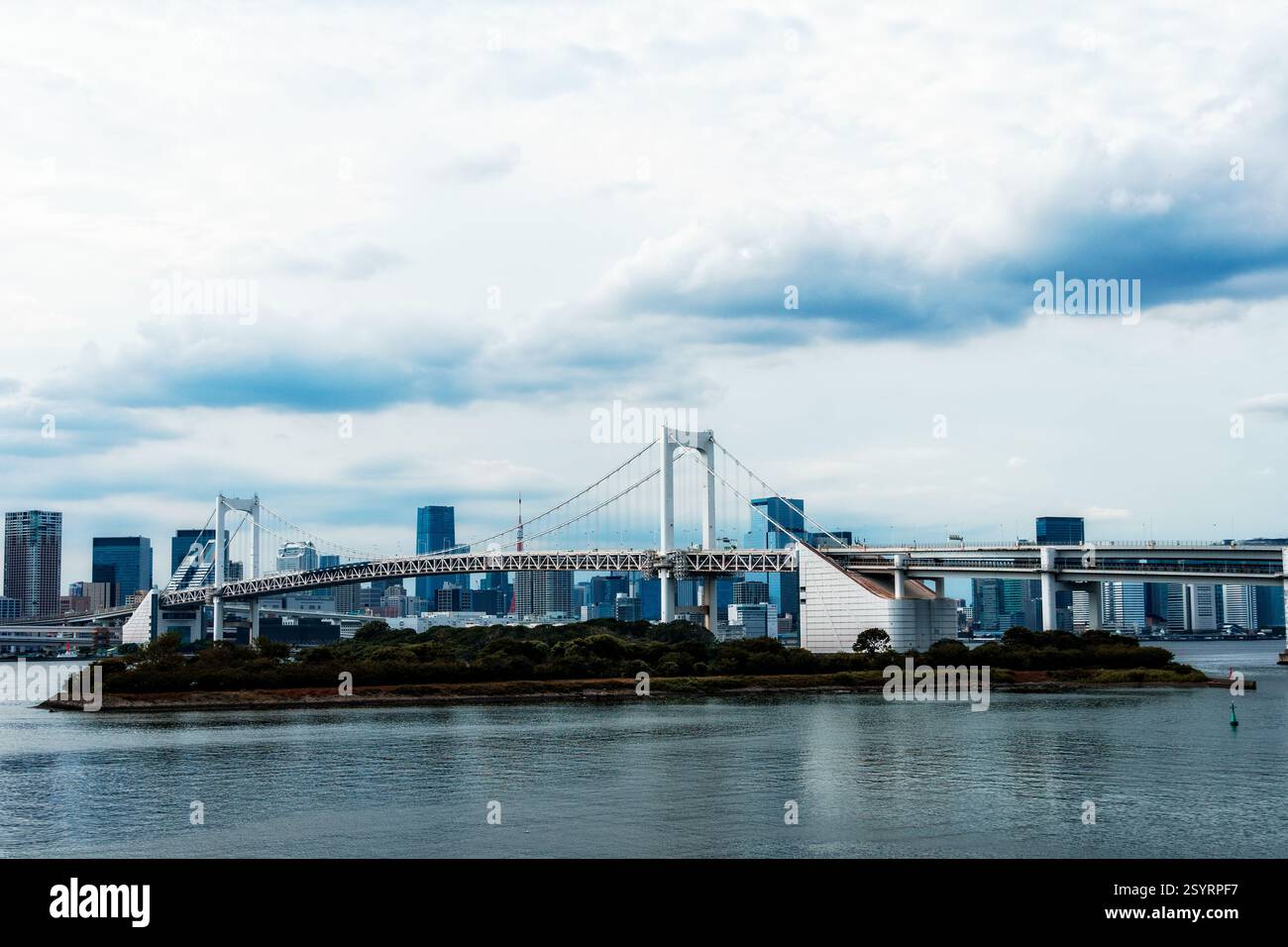 View of the Rainbow Bridge in Odaiba, Tokyo, Japan, on an overcast day ...