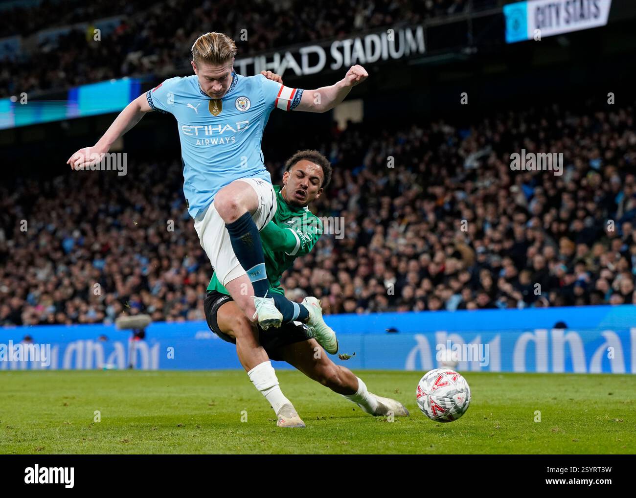 Manchester, UK. 1st Mar, 2025. Matthew Sorinola of Plymouth Argyle tussles with Kevin De Bruyne ...