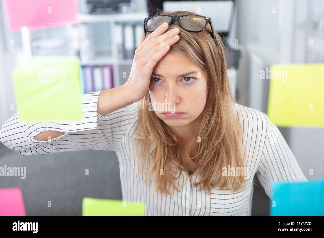 overworked woman surrounded by reminder sticky notes Stock Photo - Alamy