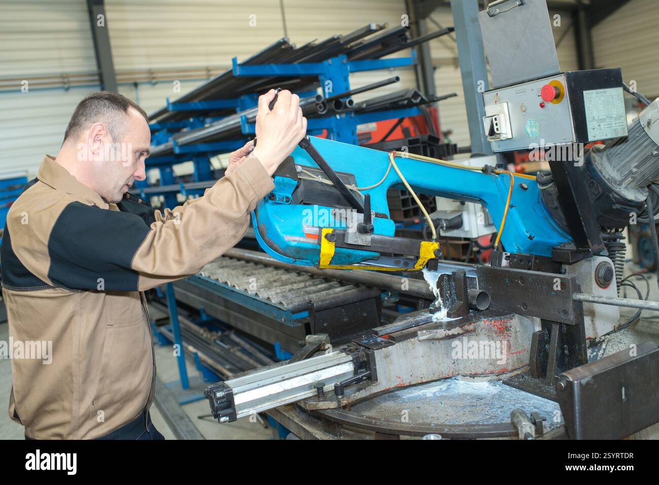 worker fixing a machine Stock Photo - Alamy