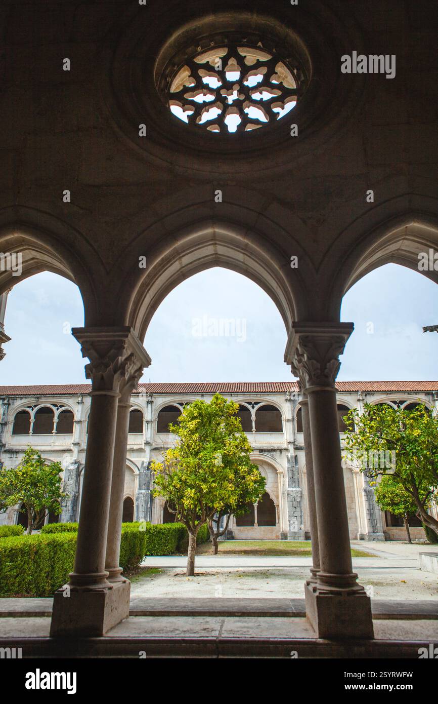 a picturesque view through a series of arched windows within a historic ...