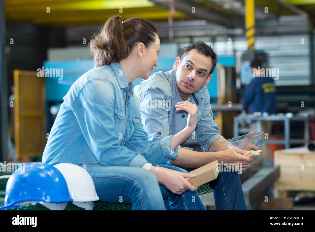 colleagues in warehouse having a break Stock Photo - Alamy
