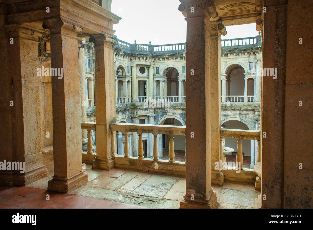 a picturesque view through a series of arched windows within a historic ...
