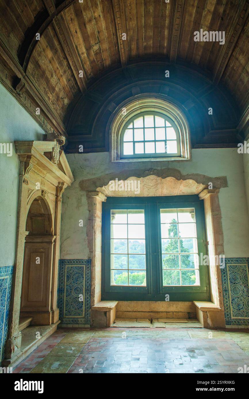 peaceful interior space with a vaulted wooden ceiling, a large window ...