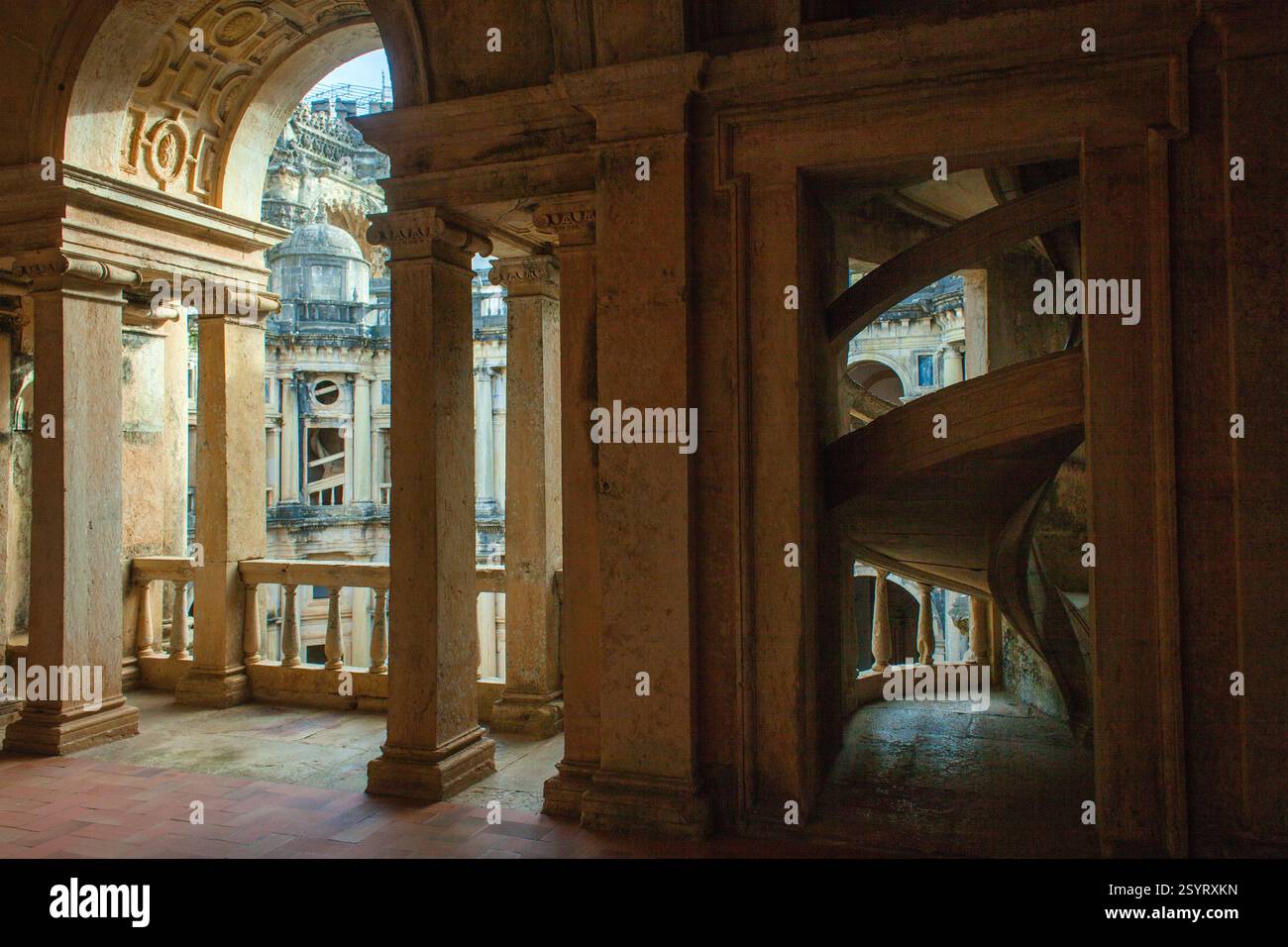 historic cloister, revealing a glimpse of a spiral staircase leading ...