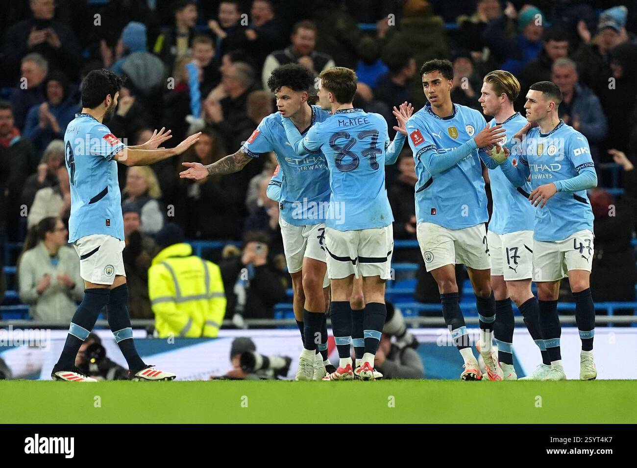 Manchester City's Nico O'Reilly (second left) celebrates scoring their ...