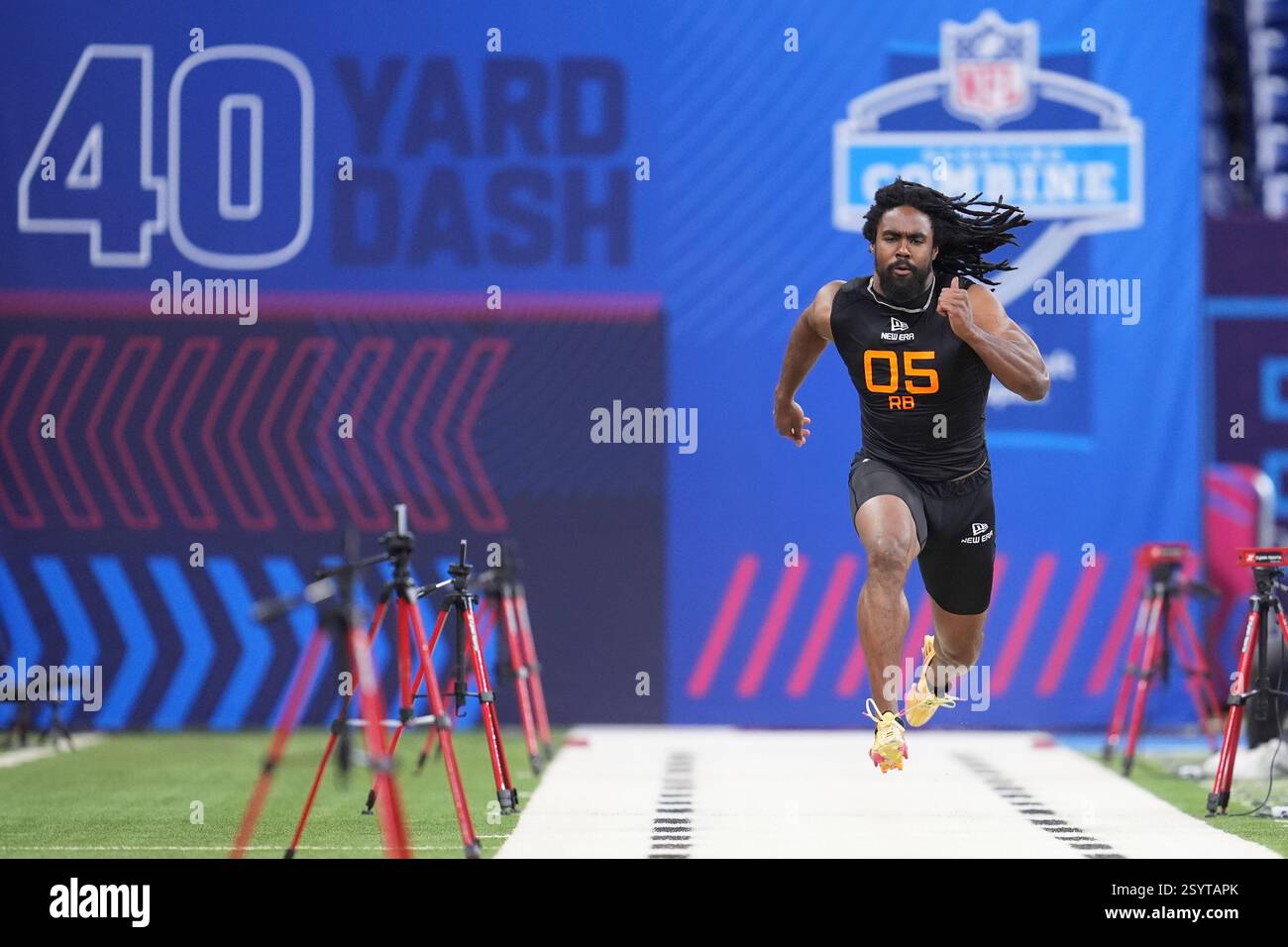 Michigan running back Donovan Edwards runs the 40-yard dash at the NFL ...