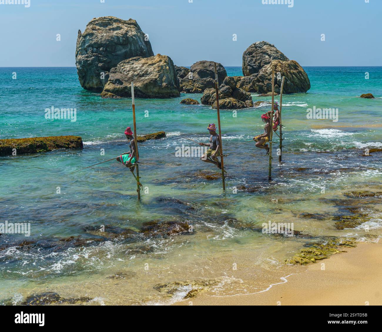 Traditional fishermens fishing on a stick on the coast of Koggala, Sri ...