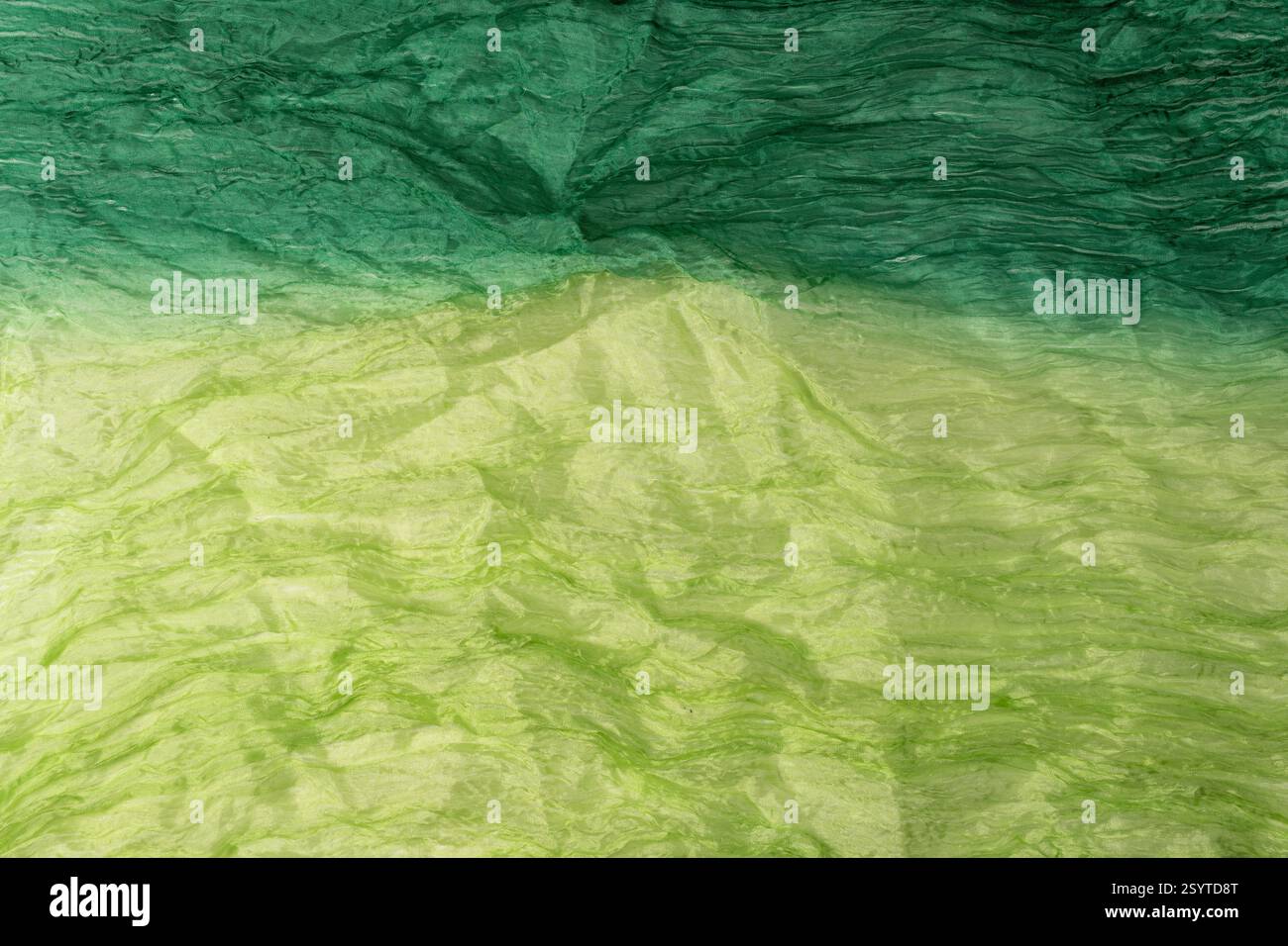 Green wrinkled fabric background Stock Photo - Alamy
