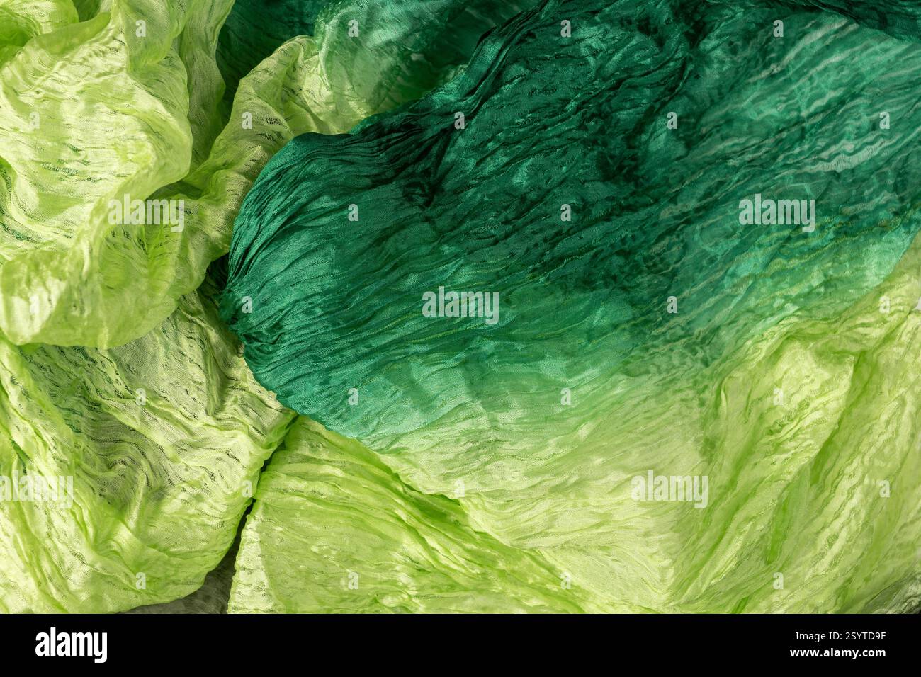 Green wrinkled fabric background Stock Photo - Alamy