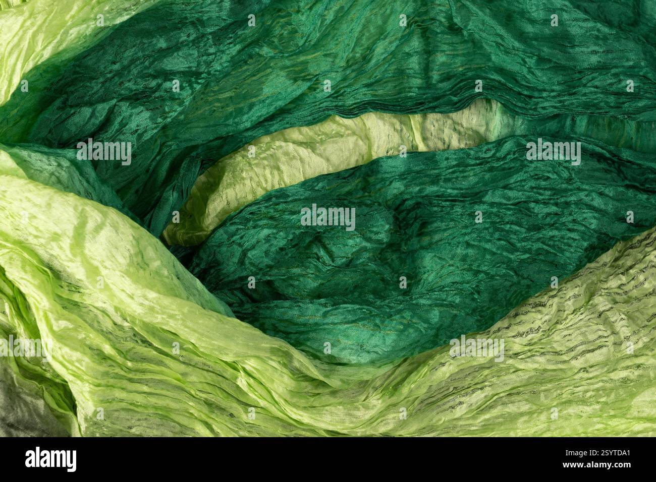 Green wrinkled fabric background Stock Photo - Alamy
