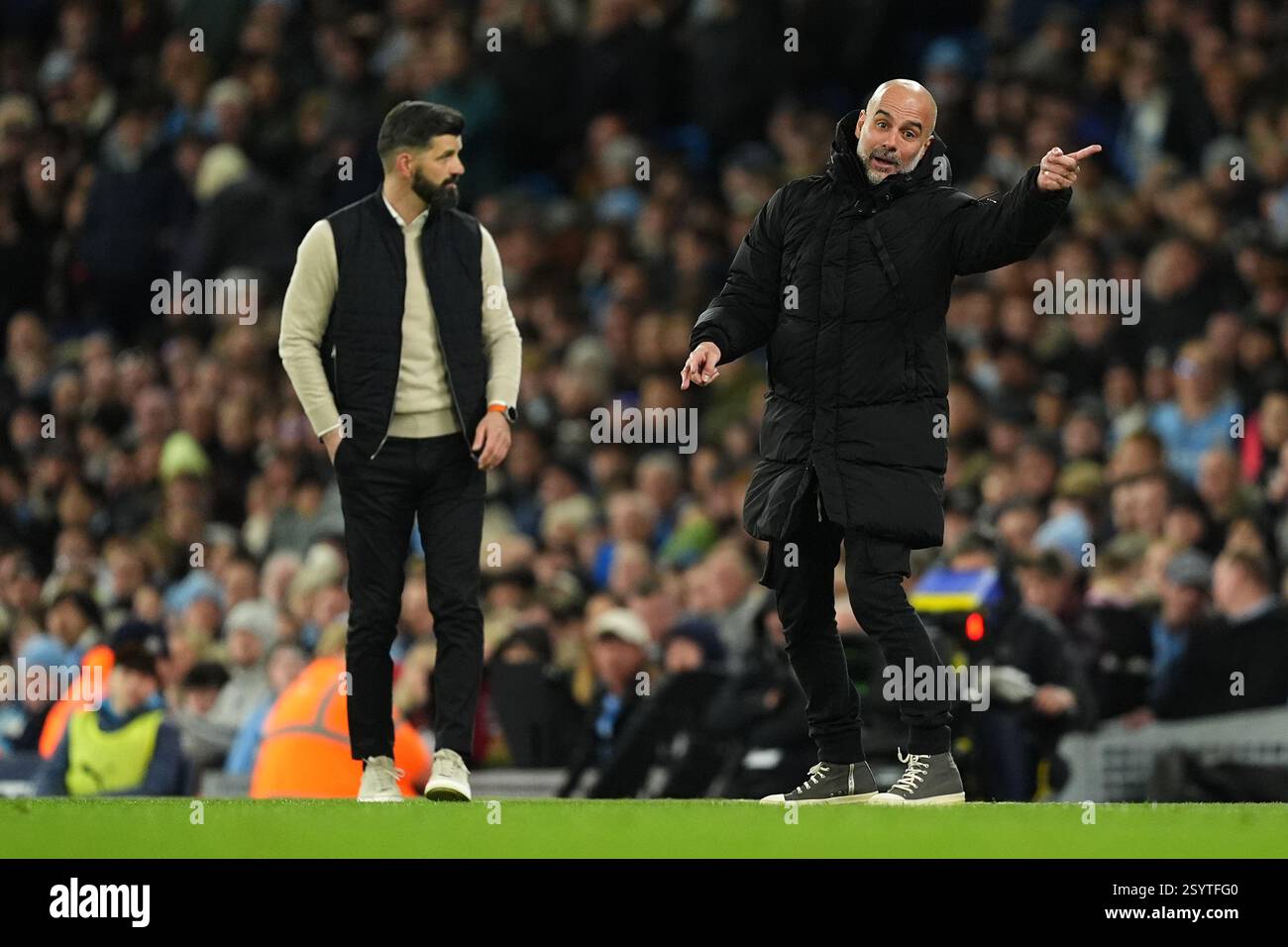 Manchester City manager Pep Guardiola (right) and Plymouth Argyle ...