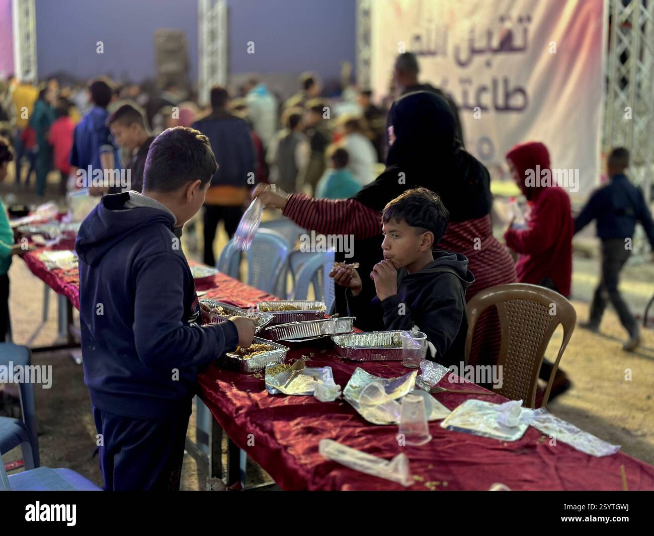 Palestinians break their fast by eating the Iftar meals during the holy ...