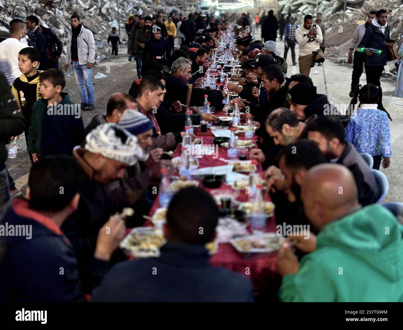 Palestinians break their fast by eating the Iftar meals during the holy ...